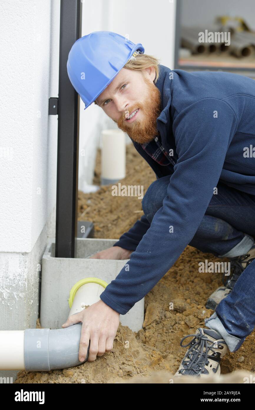 male worker repair of broken pipes Stock Photo - Alamy