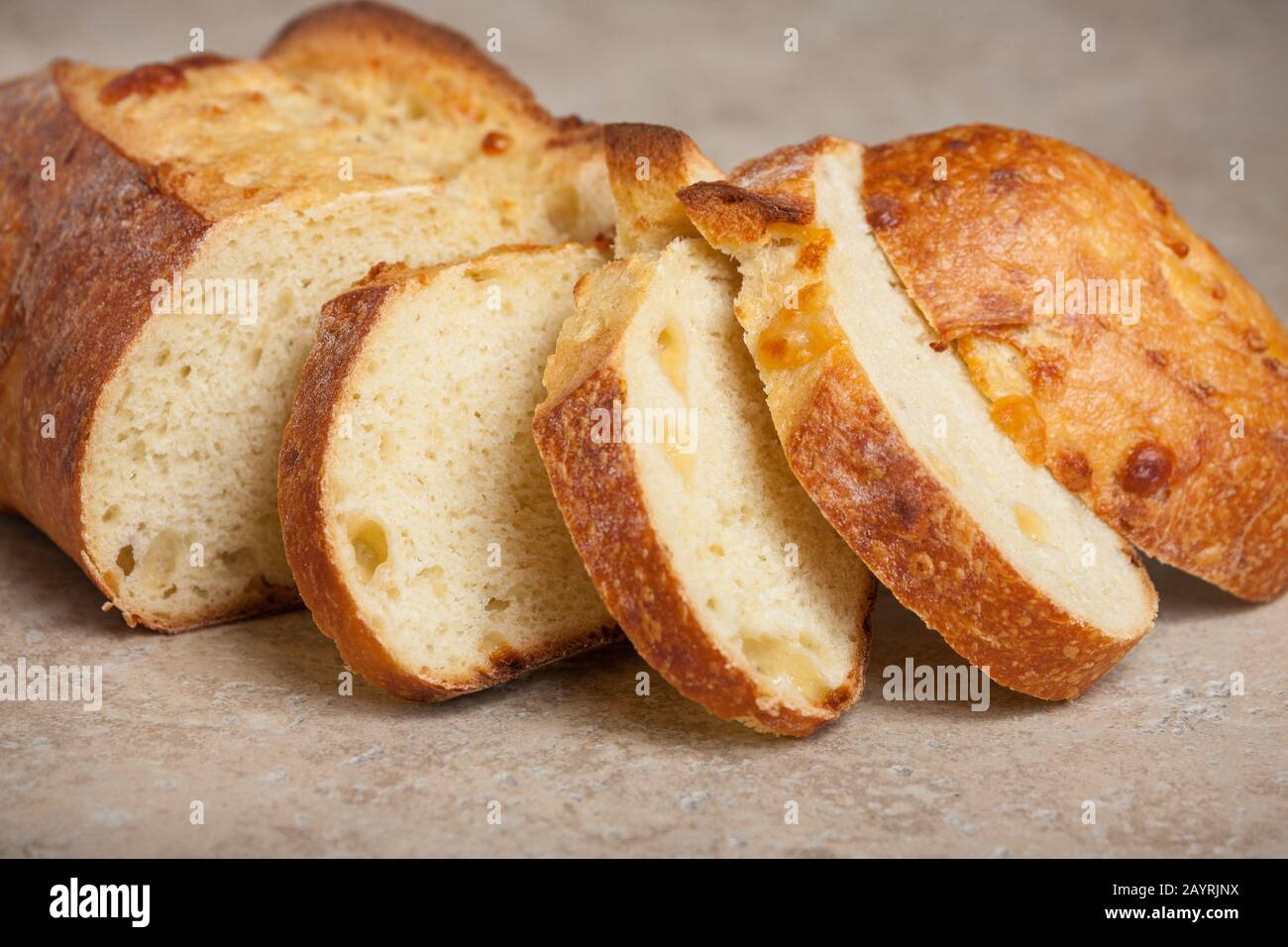 Loaf and slices of three cheese bread Stock Photo - Alamy