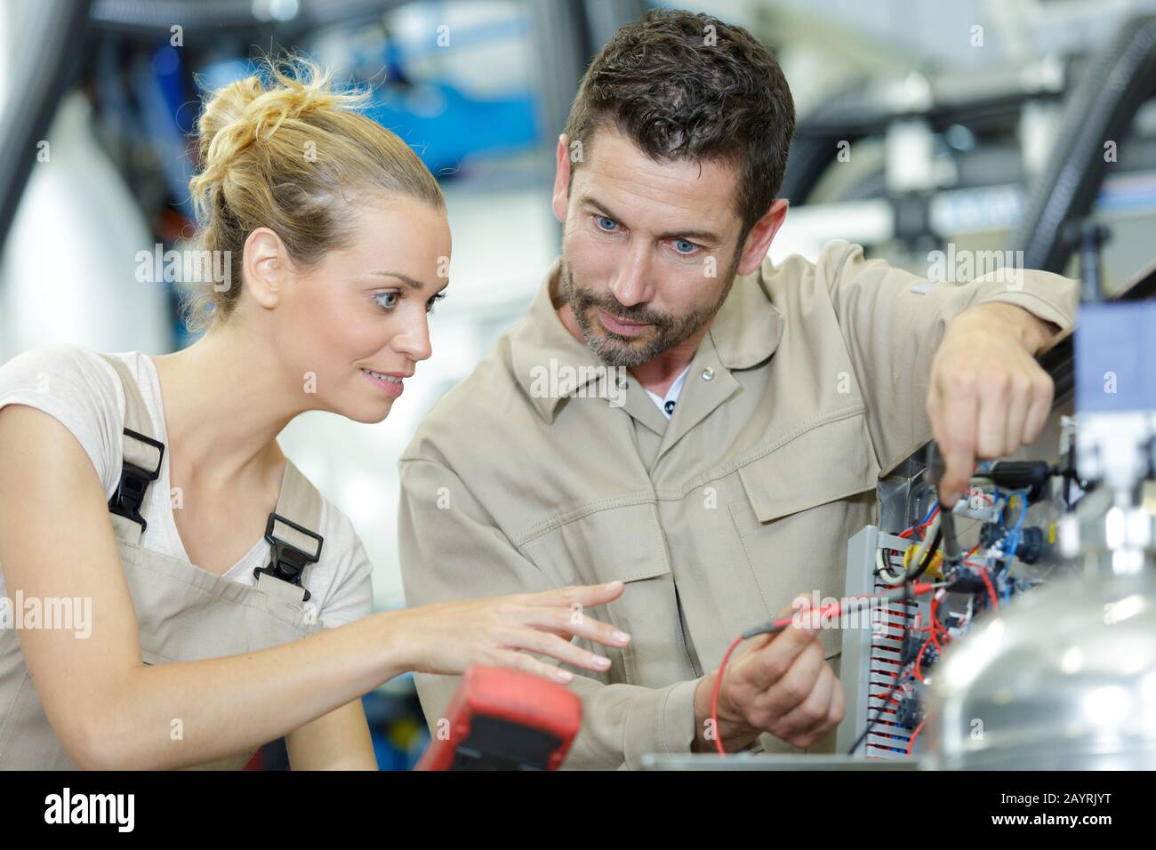 workers checking equipment cables and piping Stock Photo - Alamy