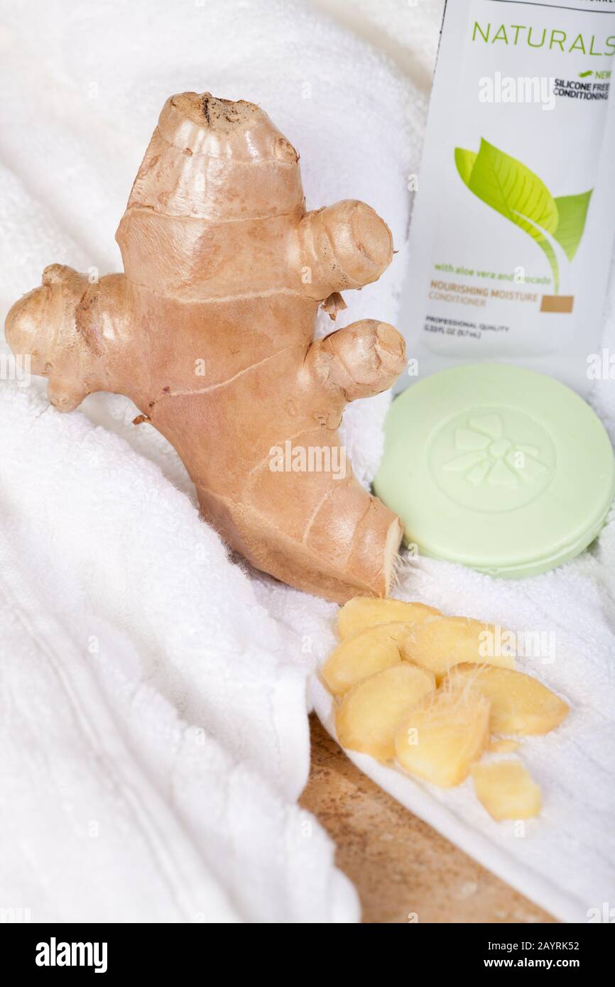 Ginger (Zingiber officinale) rhizome and slices in a spa setting for ...