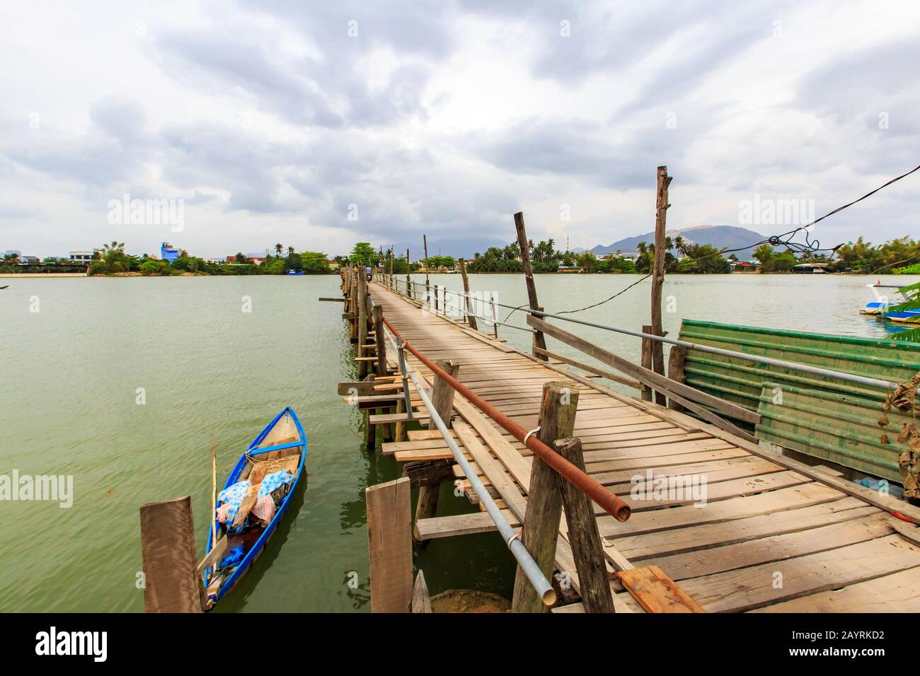 Old wooden Vietnamese bridge for motorcyclists and motobikes. Narrow ...