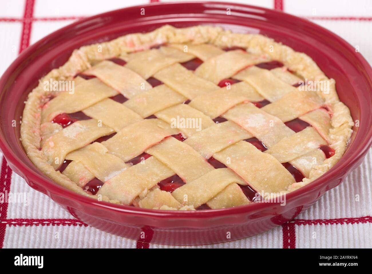 Unbaked cherry pie with lattice top Stock Photo - Alamy