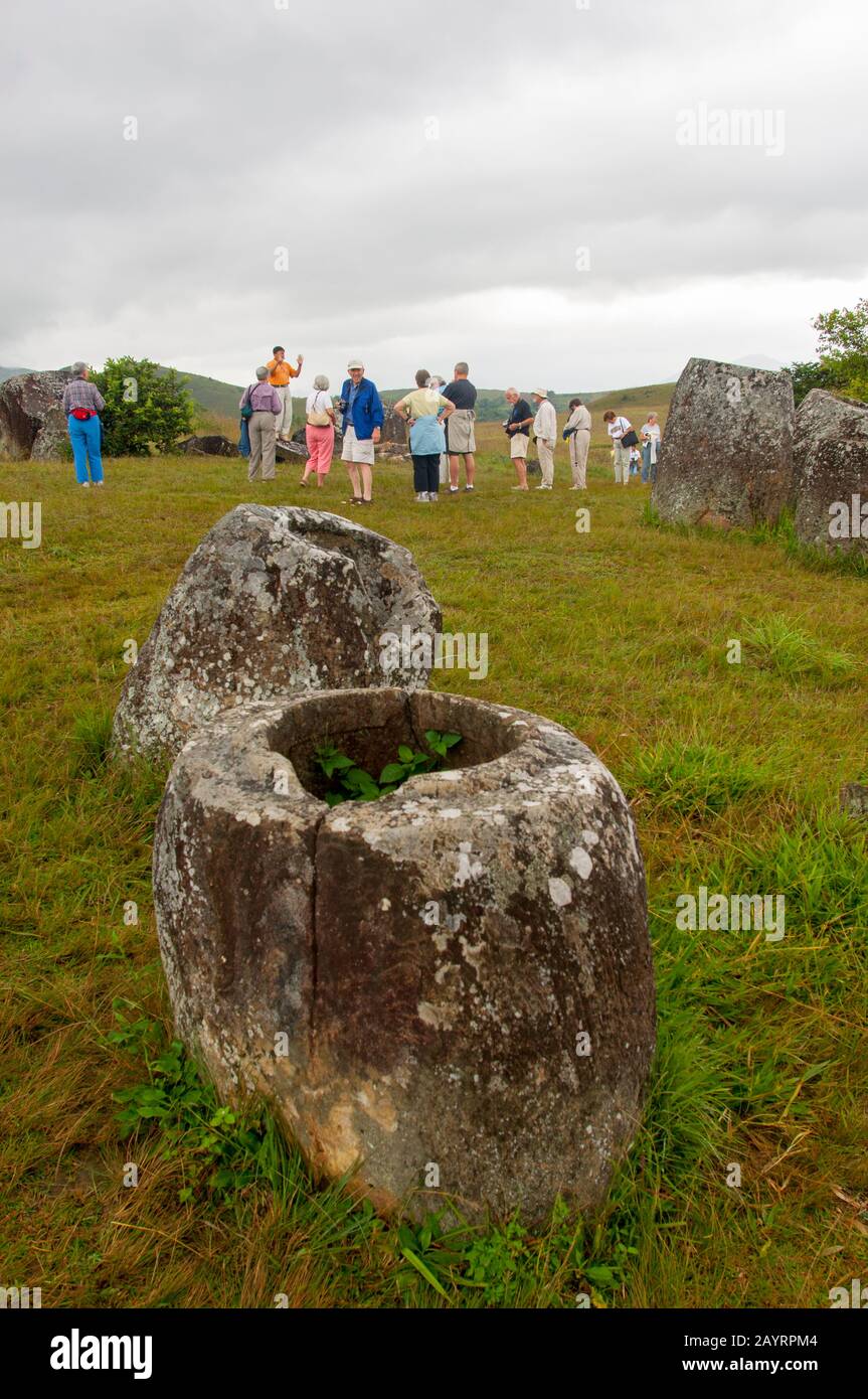 Tourists are visiting the Plain of Jars which consists of thousands of ...