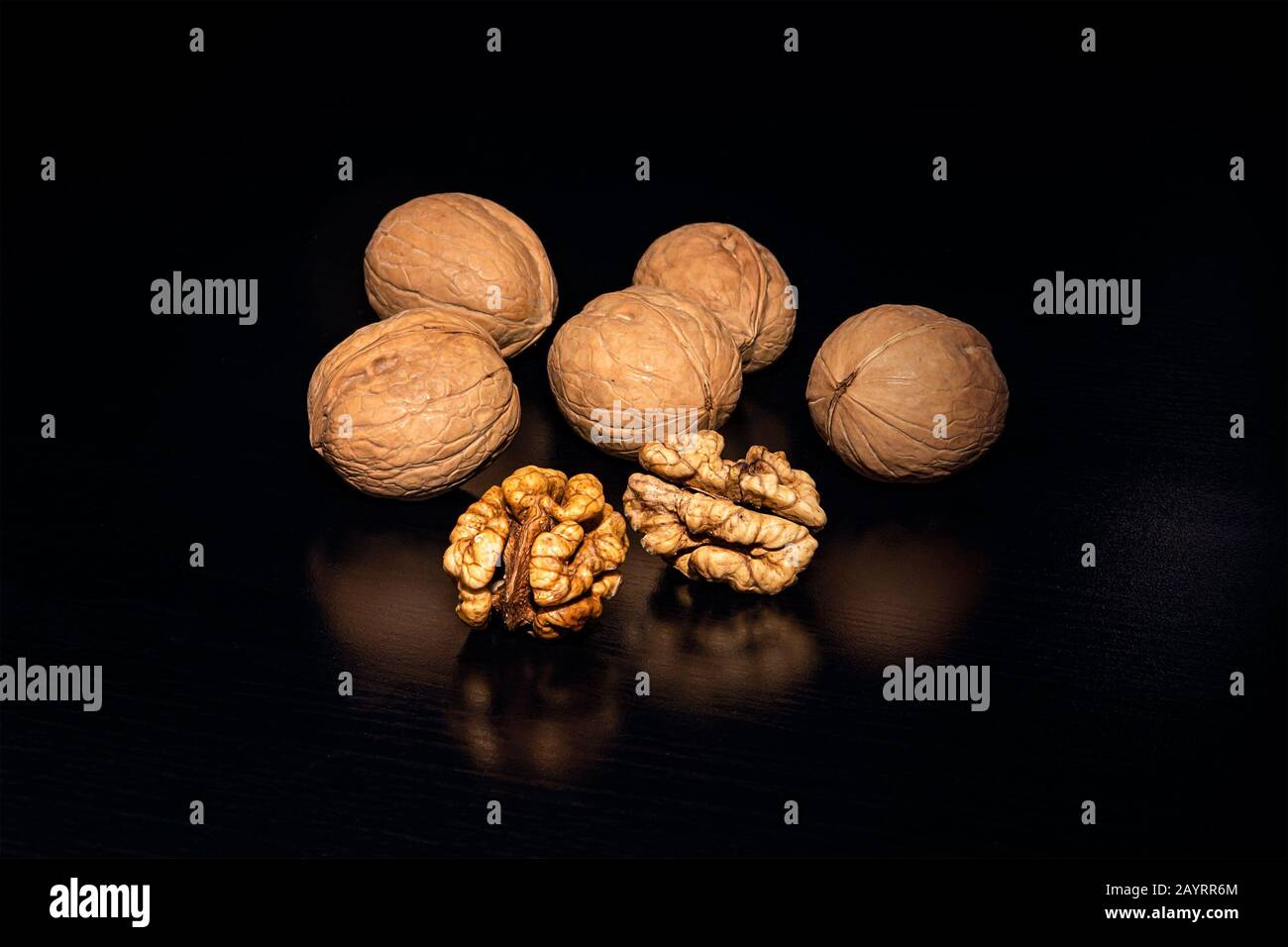 Walnuts on black background. walnut with reflection. nut kernels and ...