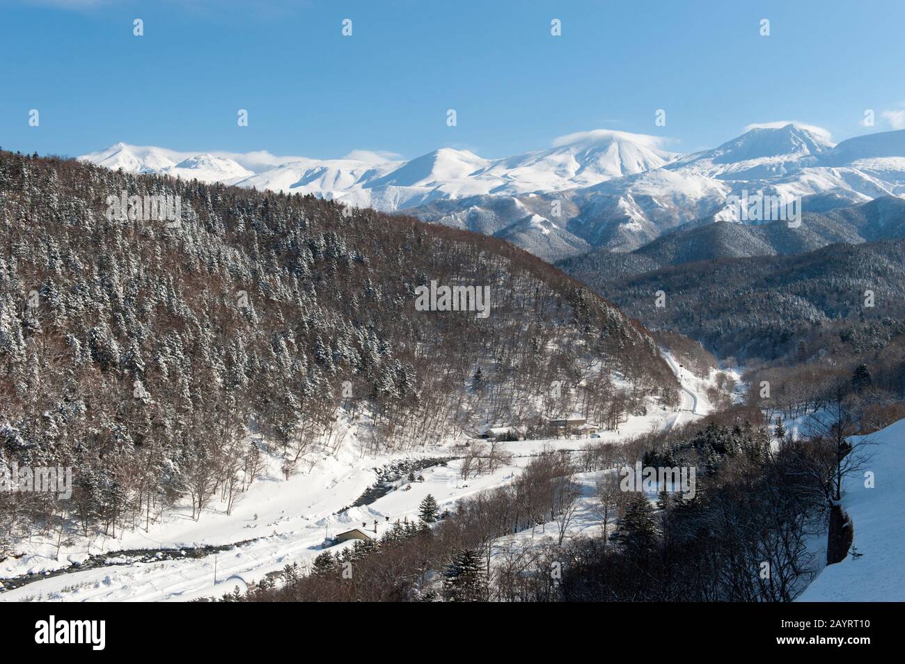 Snowy landscape in the winter with the volcanic Shiretoko mountain ...