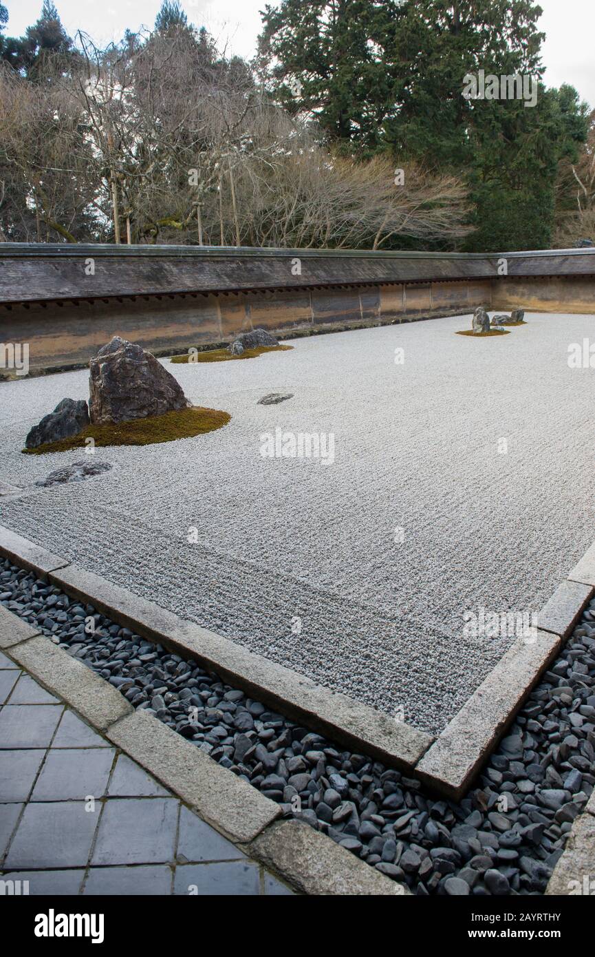 The kare-sansui (dry landscape) Zen rock garden at Ryoan-ji Temple in ...