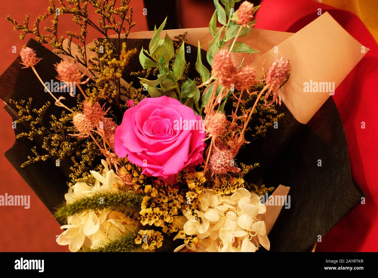 Bouquet of flowers with pink rose in center Stock Photo - Alamy