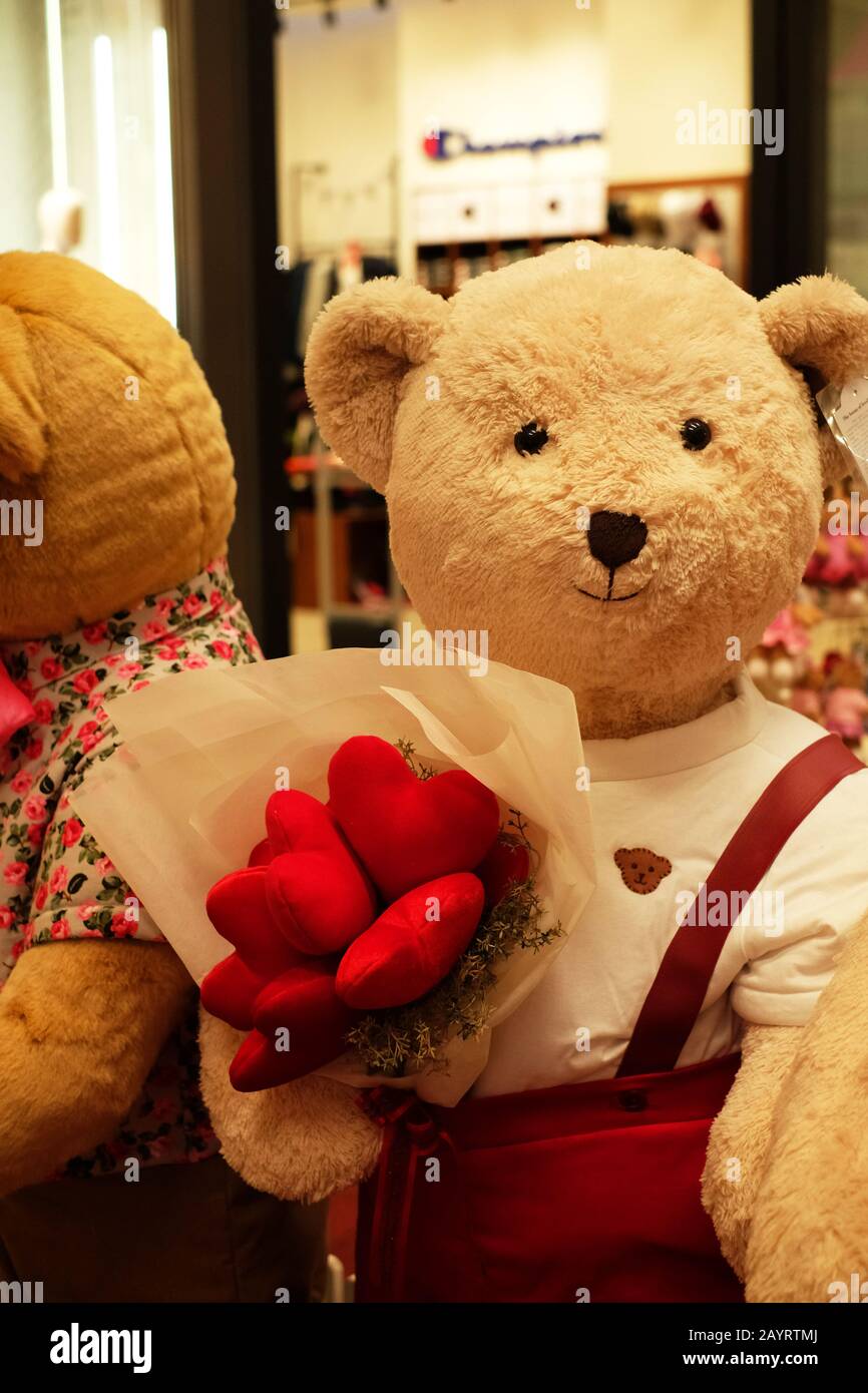 Brown bear cloth doll with red heart Stock Photo - Alamy