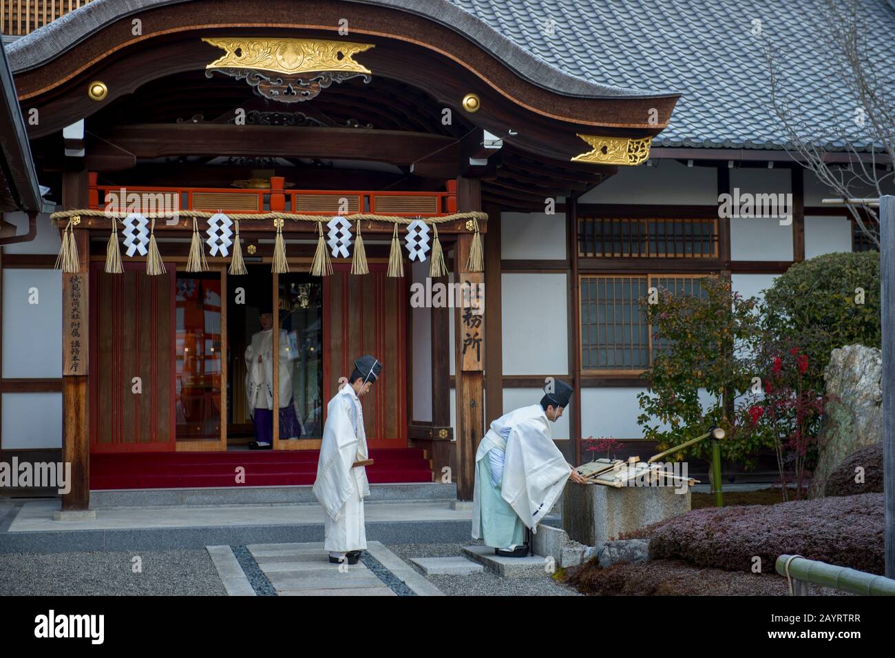 Shinto priests doing a ceremony in the morning at the Fushimi Inari ...