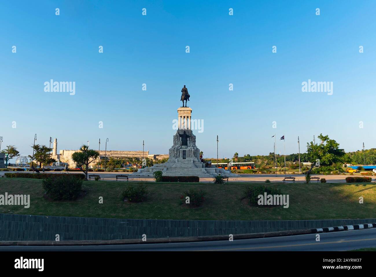 Statue of General Maximo Gomez against a blue cloudy sky. MAXIMO Gomez ...