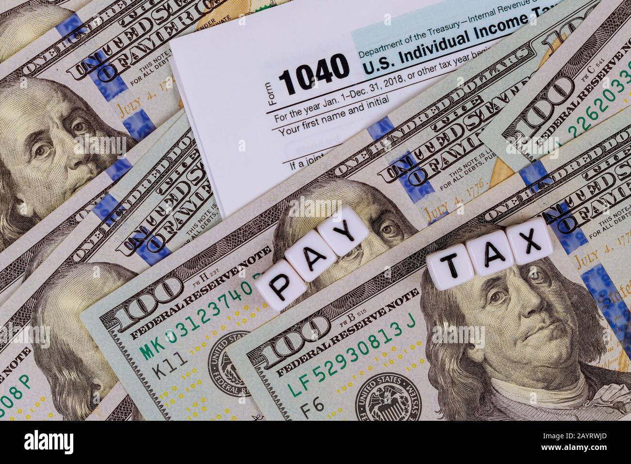 Business concept pay tax USA Tax Form 1040 with US dollar bills Stock ...
