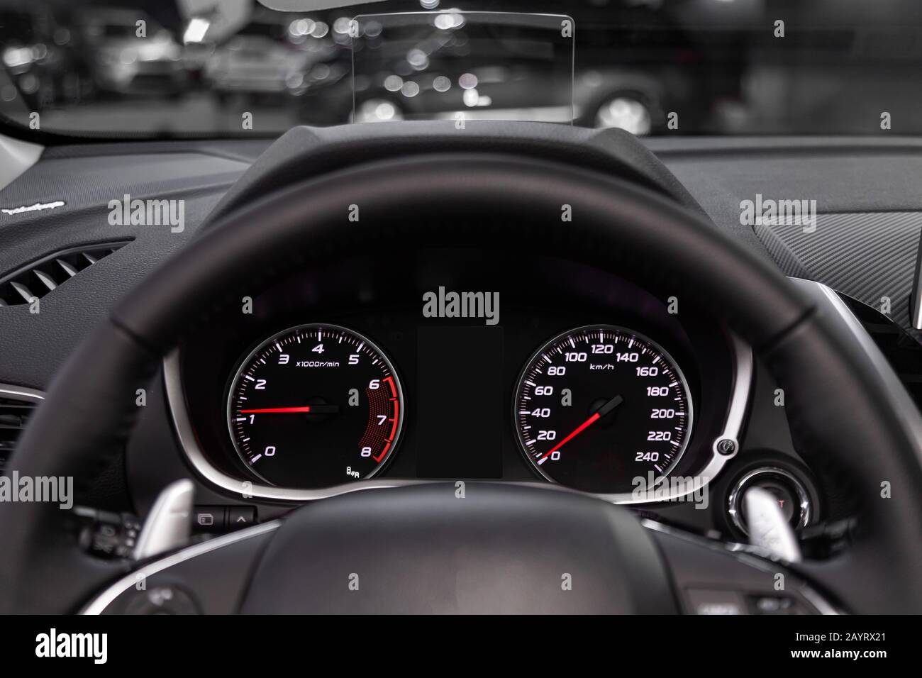 Car dashboard with white backlight: Odometer, speedometer, tachometer ...