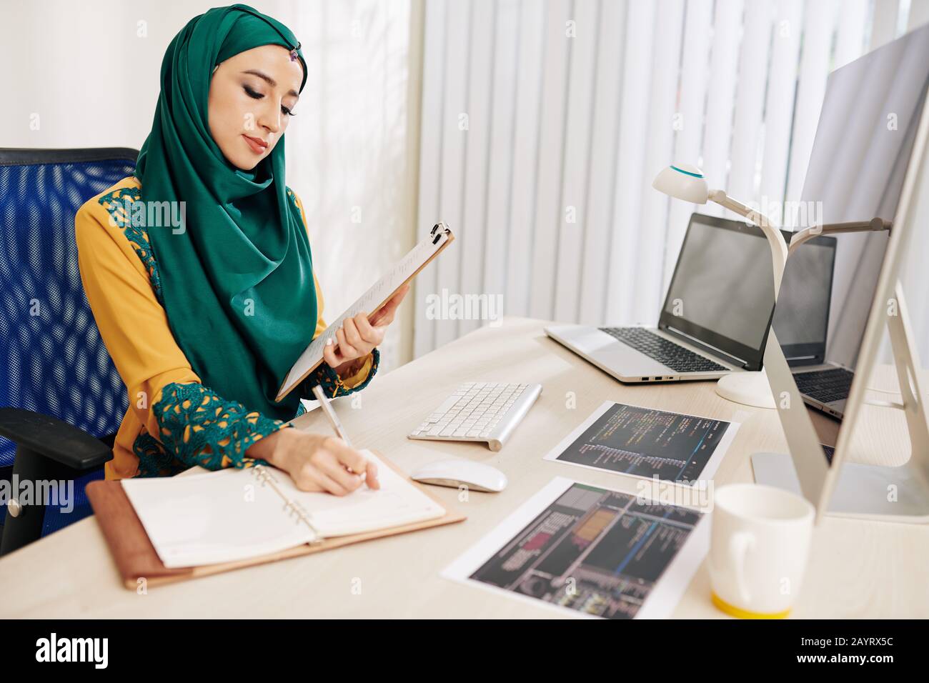 Female software engineer checking ...