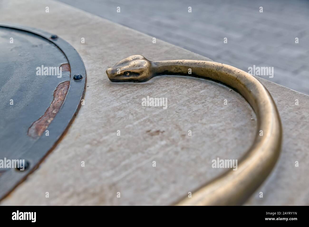 Cetinje snake on the well Stock Photo - Alamy