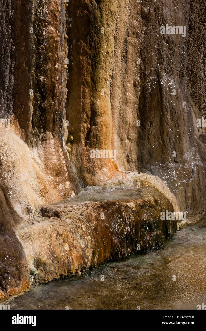 Hot mineral water flowing over a rock pyramid base for over a hundred ...