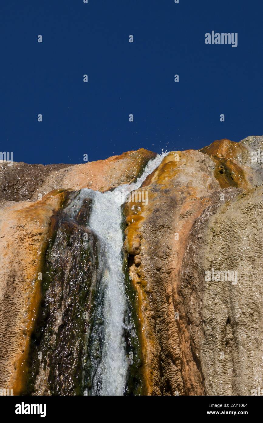 Hot mineral water flowing over a rock pyramid base for over a hundred ...