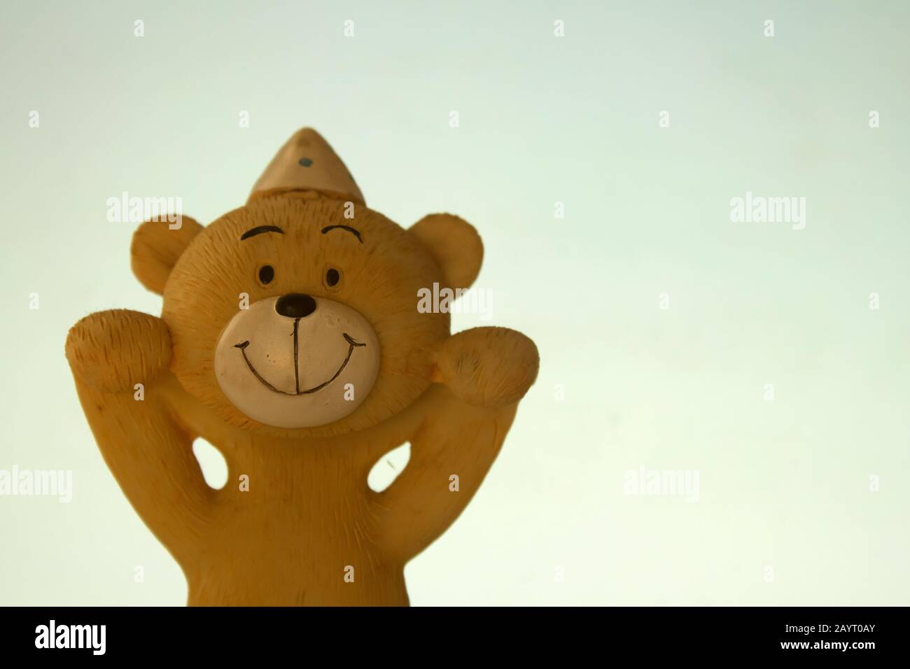 View of cute little monkey toy with its hands raised Stock Photo - Alamy