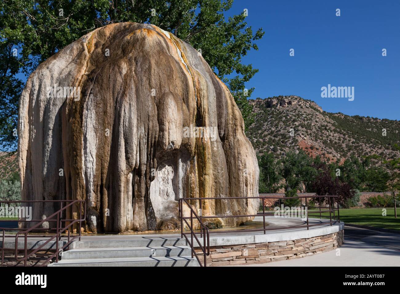 Hot mineral water flowing over a rock pyramid base for over a hundred ...