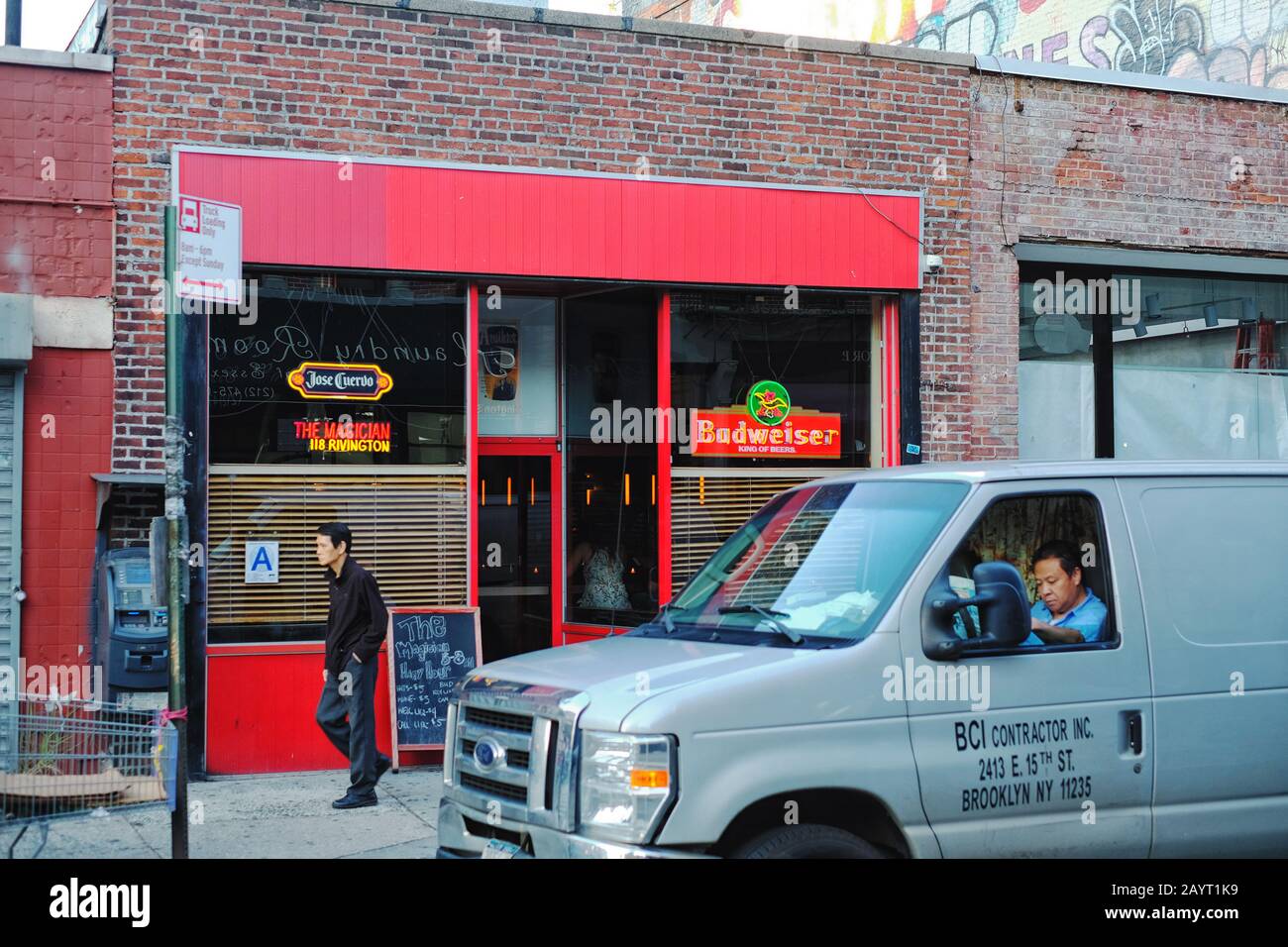 Street view of a single story shop front bar in Greenwich Village, New ...