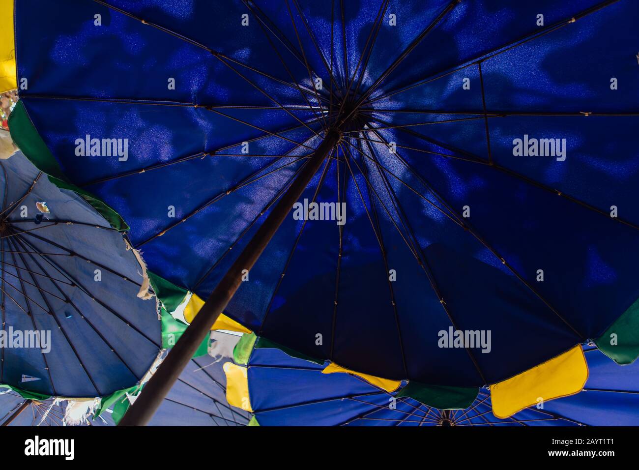 Blue beach umbrellas for sun protecrion closeup background Stock Photo ...