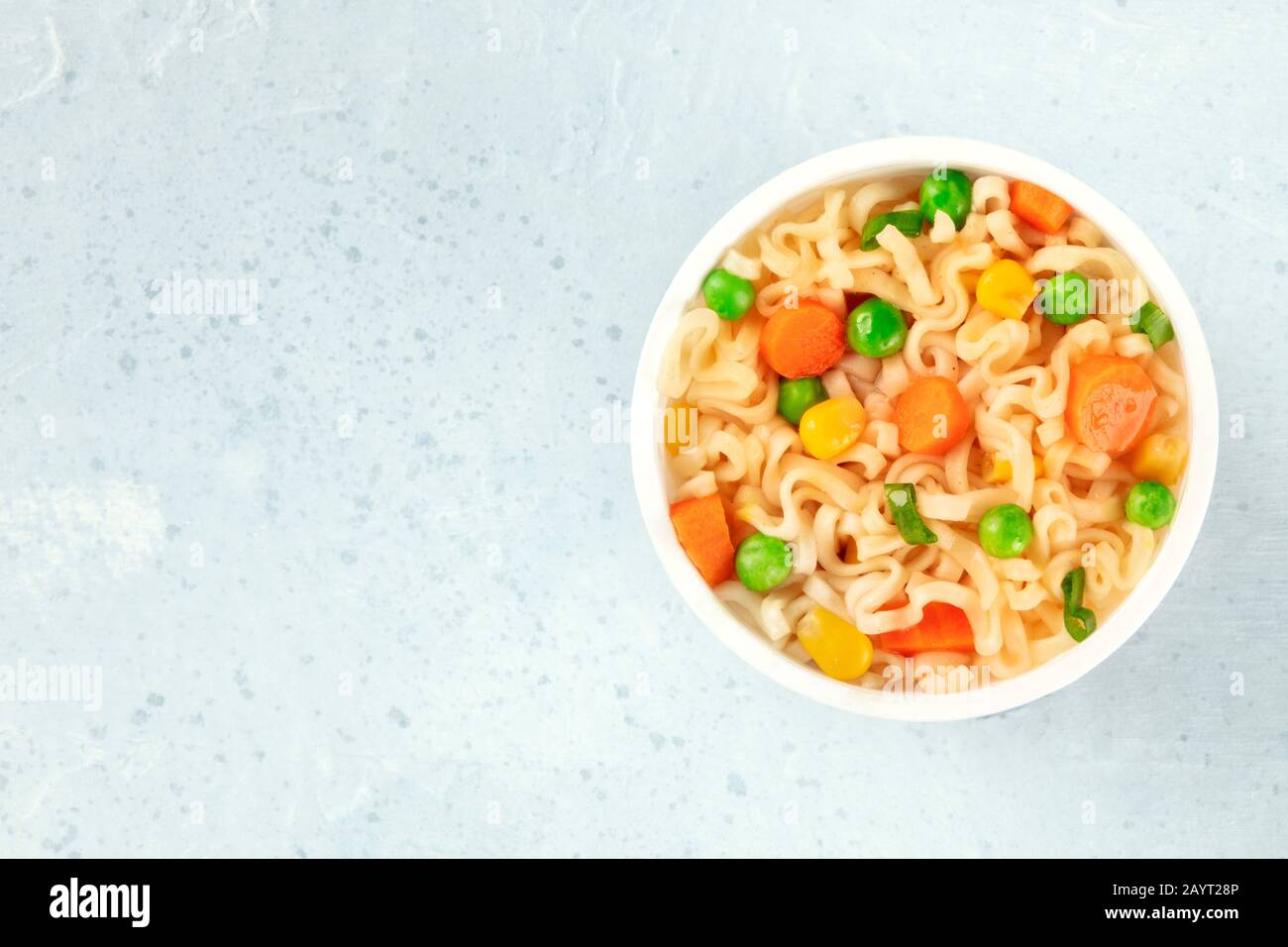 Ramen cup, instant soba noodles in a plastic cup, with green peas ...