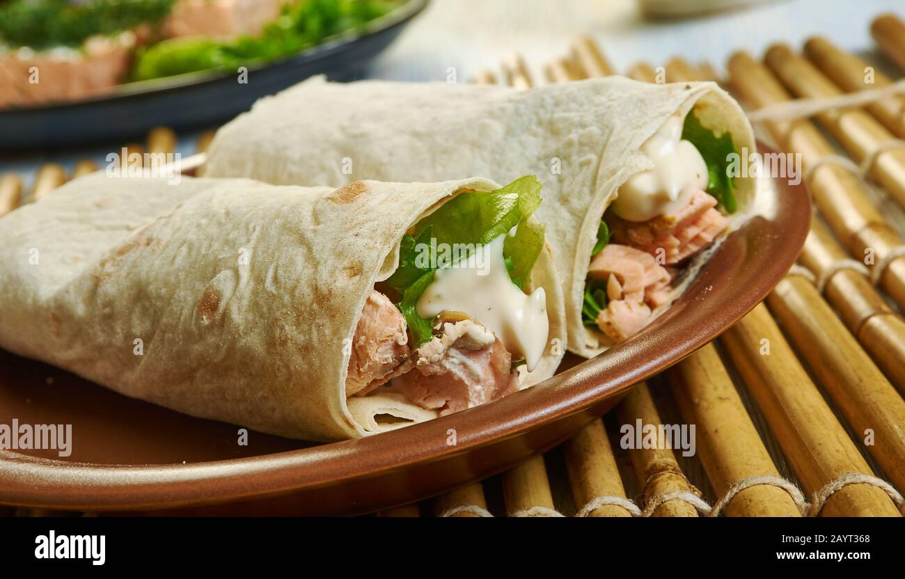 Salmon and Kale Caesar Wraps shredded Parmesan cheese Stock Photo - Alamy