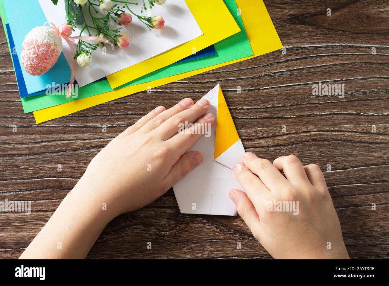 Origami instruction, step 6. The child fold the origami Easter chick ...