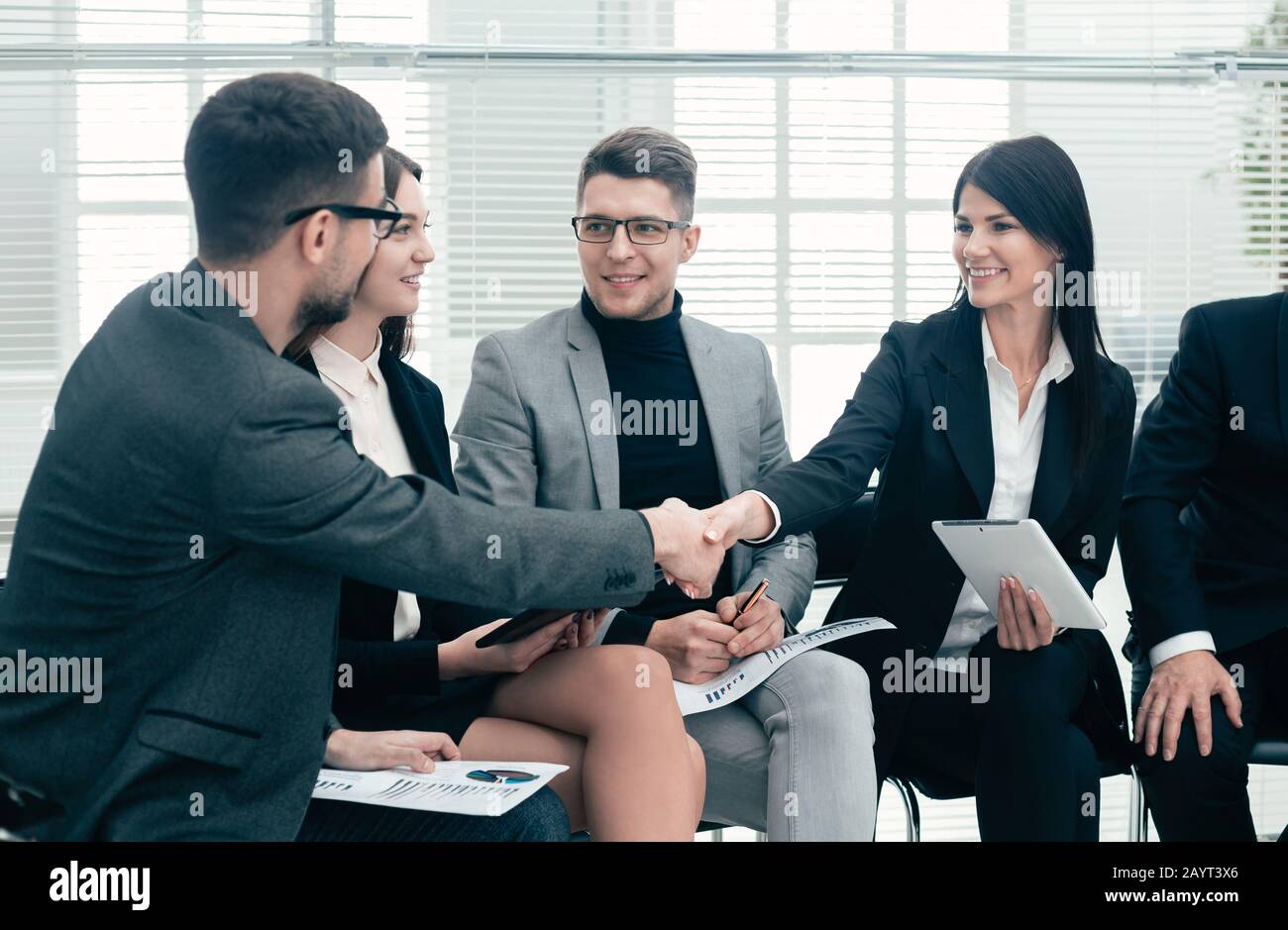 business colleagues greet each other at an office meeting. concept of ...