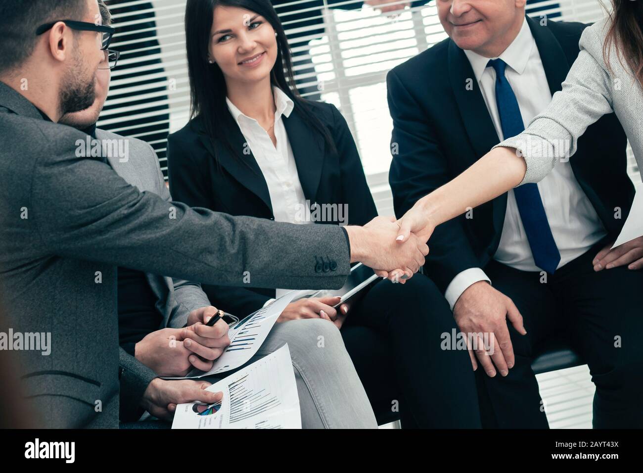 business colleagues shaking hands with each other. the concept of ...