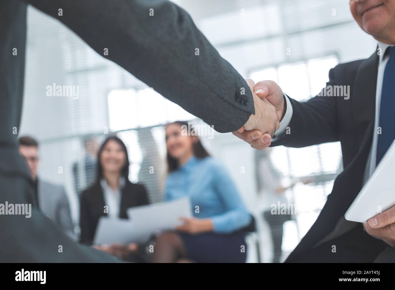 close up. handshake of business partners in the background of the ...