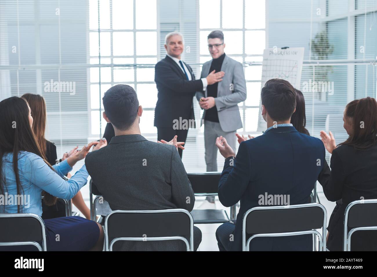 Manager is introducing a new employee of the company at a meeting with ...