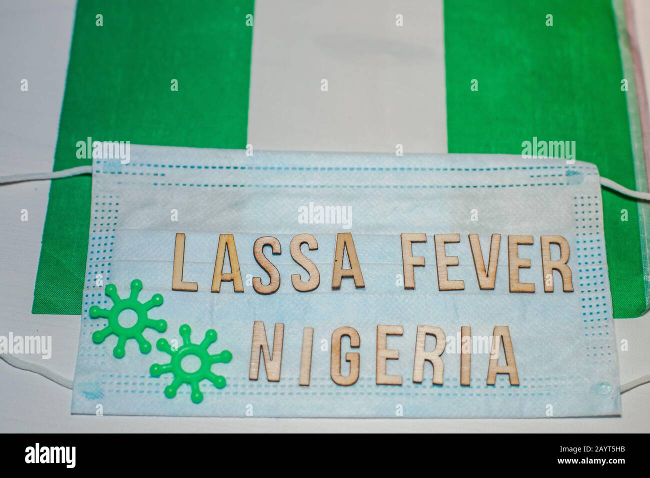 Nigerian flag under words Lassa fever outbreak concept. protective ...