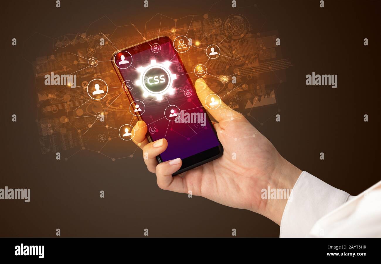 Female hand holding smartphone with CSS abbreviation, modern technology ...