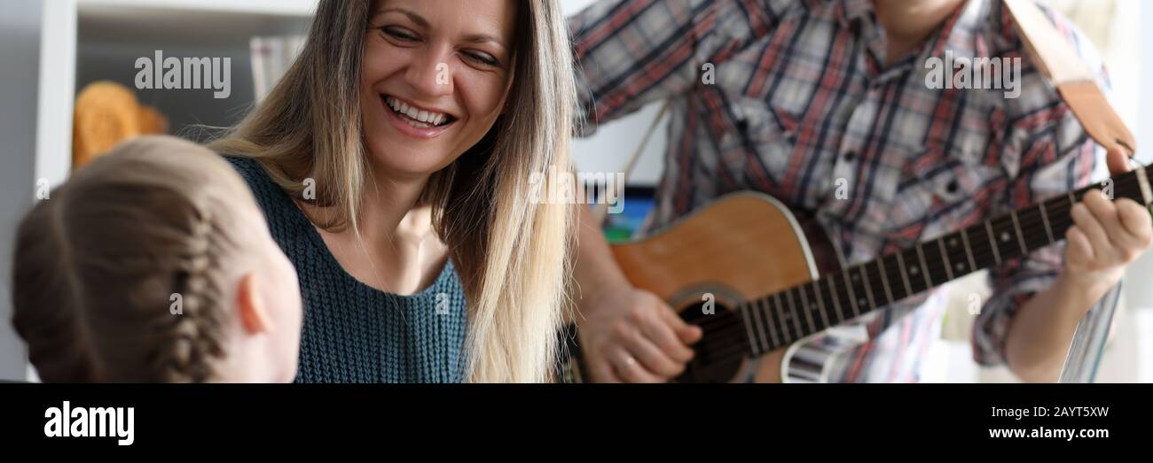 Happy family plays musical instruments on background Stock Photo - Alamy