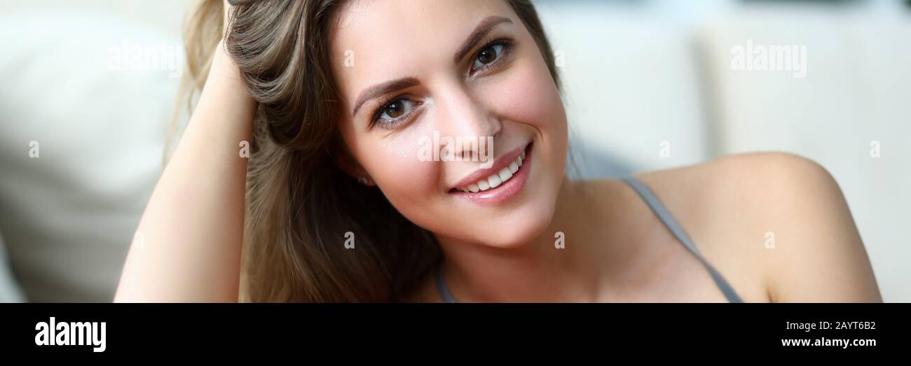 Beautiful lady leaning on hand Stock Photo - Alamy