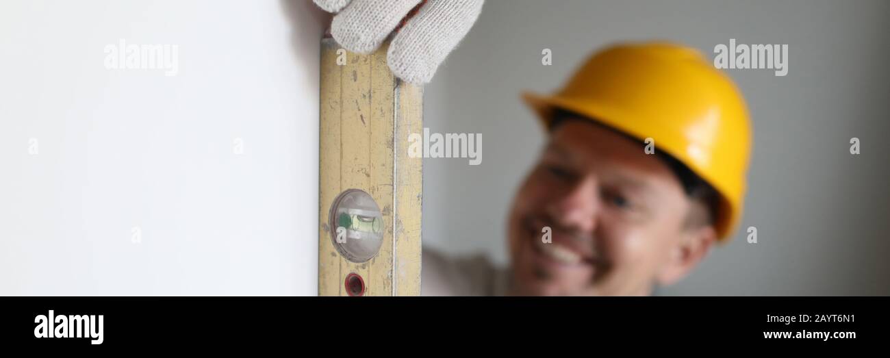 Worker with measuring ruler Stock Photo - Alamy