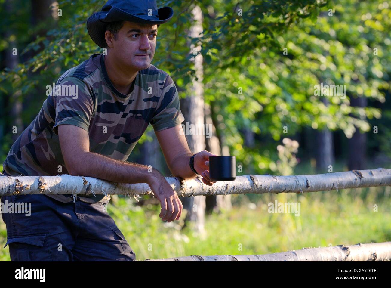 Man drinking coffee campfire hi-res stock photography and images - Alamy