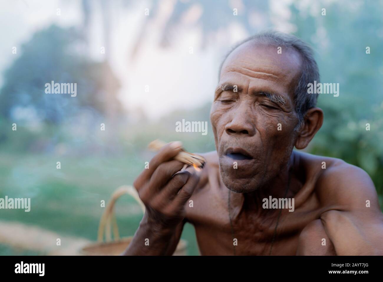 Older men are smoking in the countryside Stock Photo - Alamy