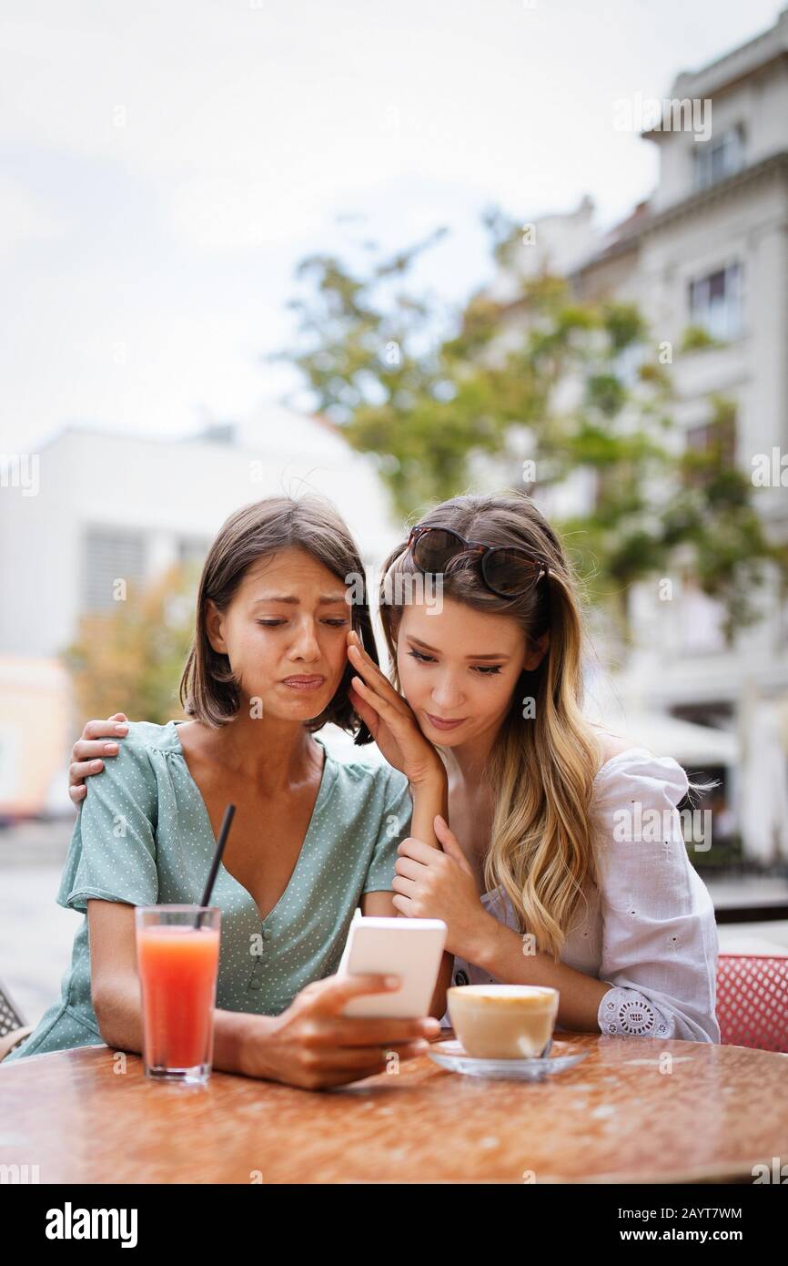 Desperate woman getting support from her best friend Stock Photo - Alamy