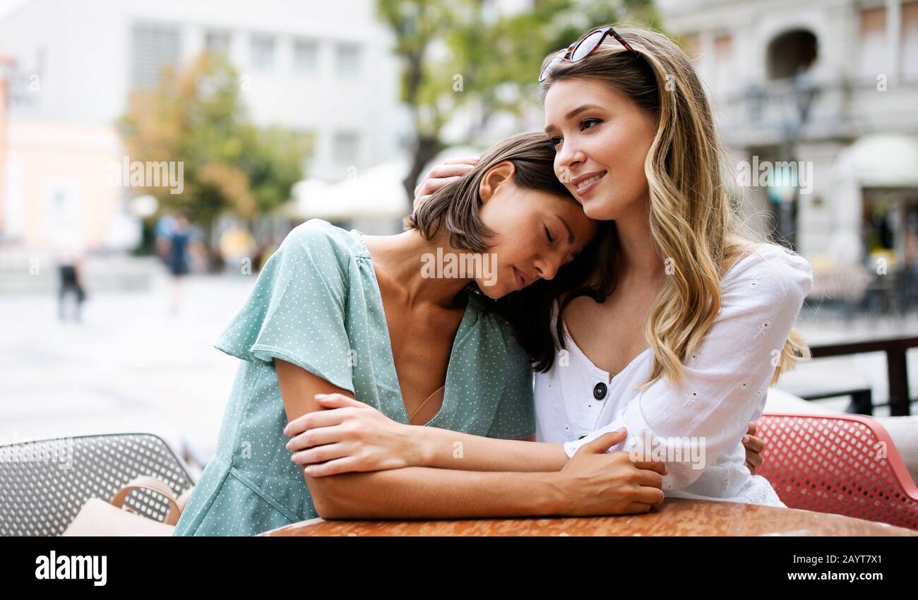 Desperate woman getting support from her best friend Stock Photo - Alamy
