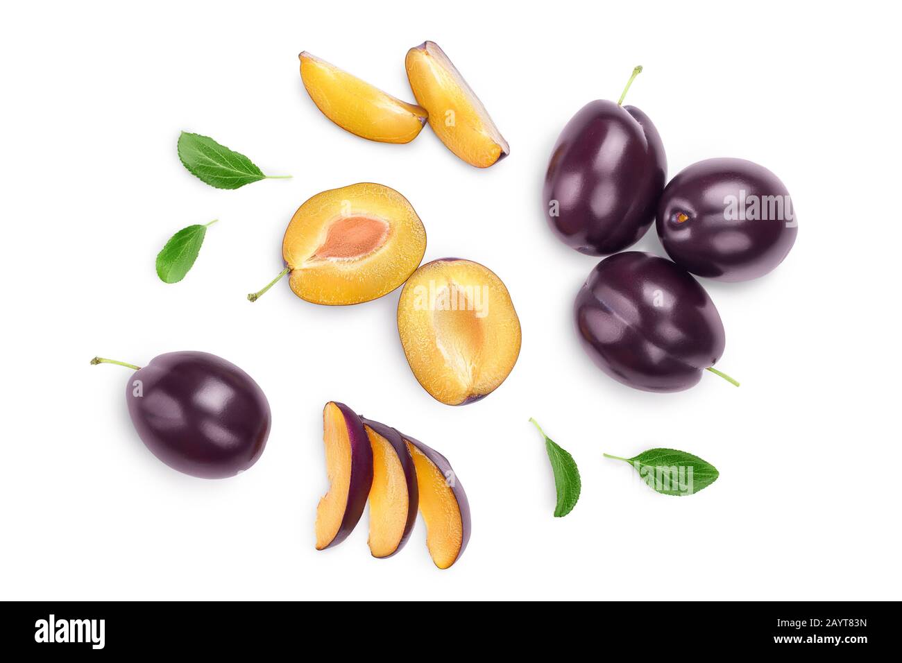 fresh purple plum and half with leaves isolated on white background ...