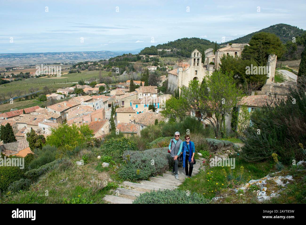 Women walking in the medieval village of Gigondas in the Vaucluse ...