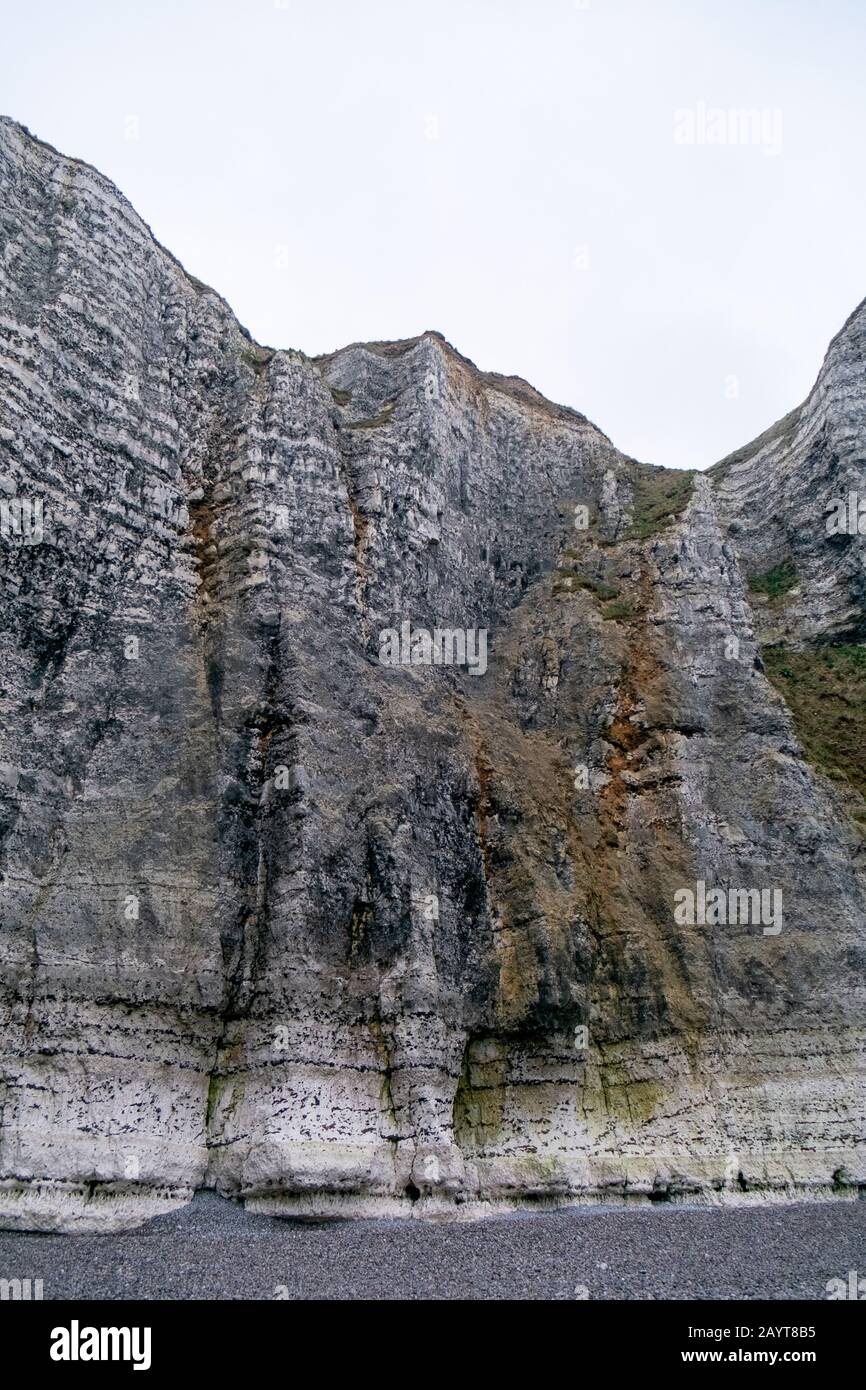 Misty morning landscape of the Natural white chalk cliffs in Etretat ...
