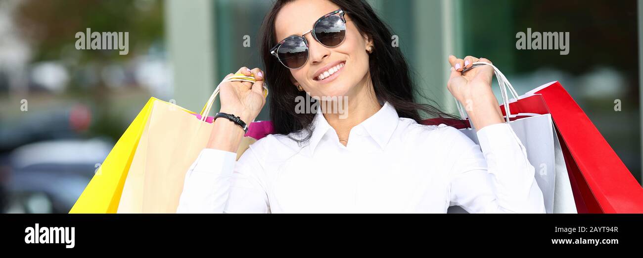 Cute woman with packages Stock Photo - Alamy