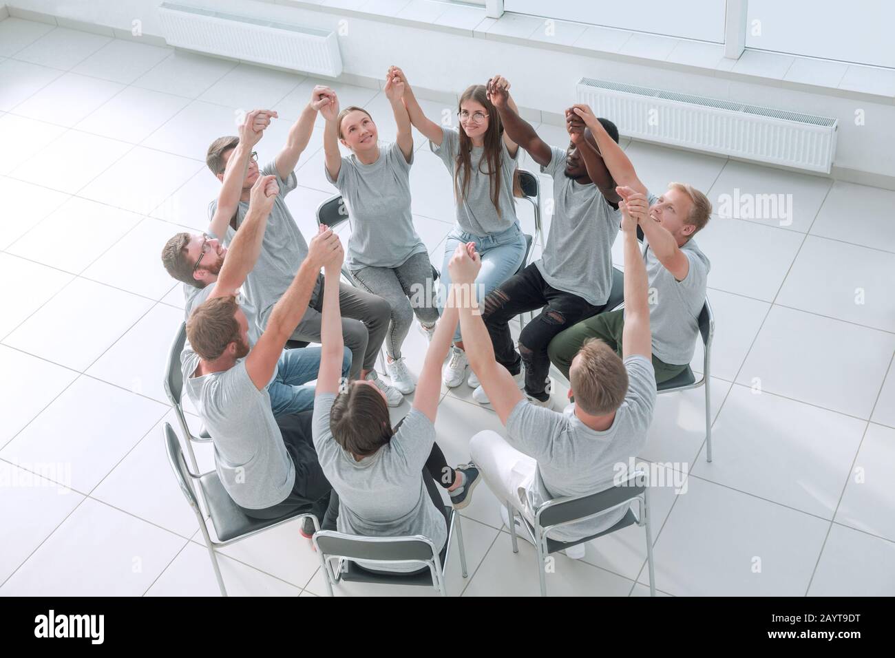 group of young people joining their hands together Stock Photo - Alamy