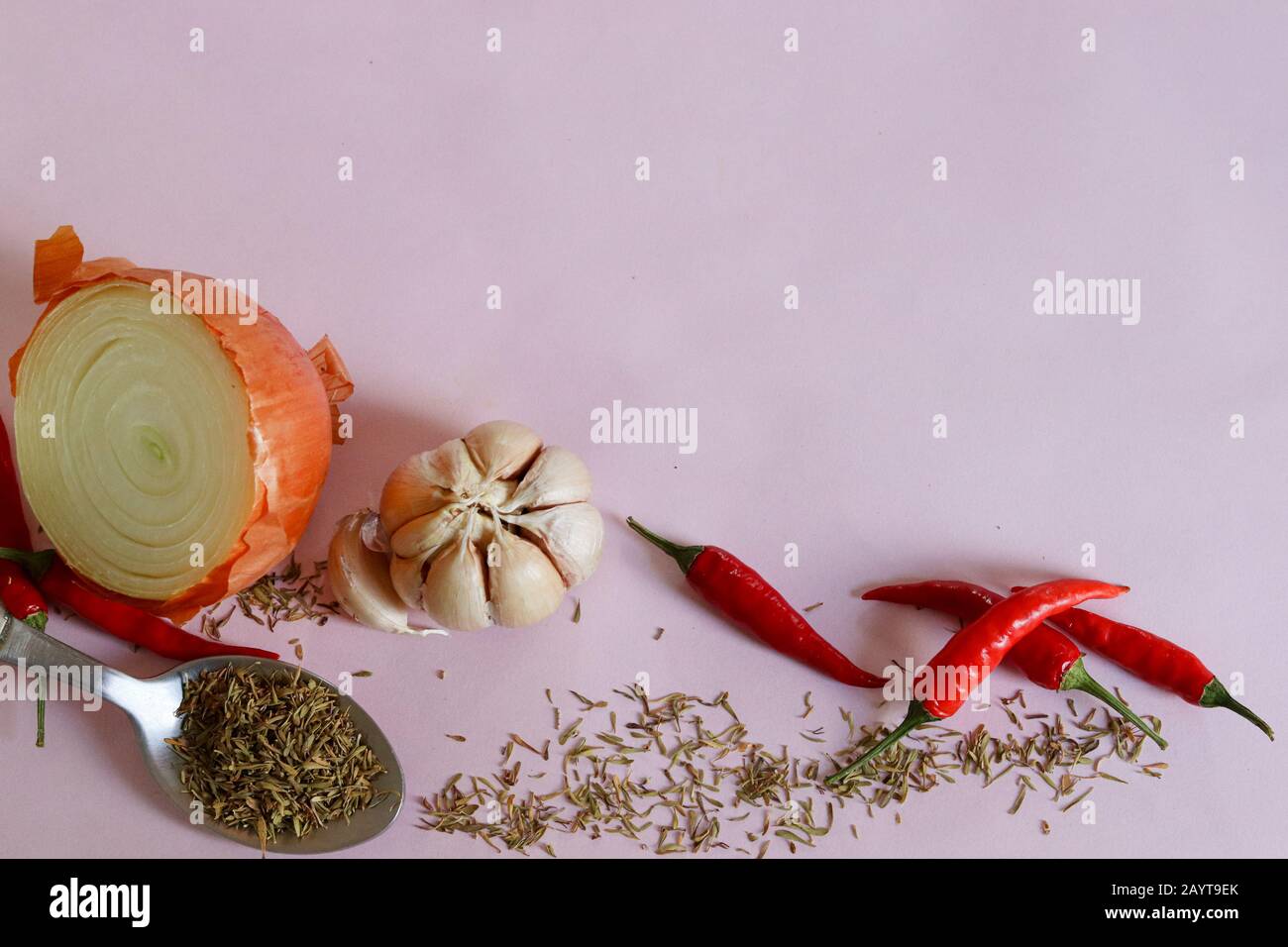 Flat layout of cooking seasoning against a pink background to show ...