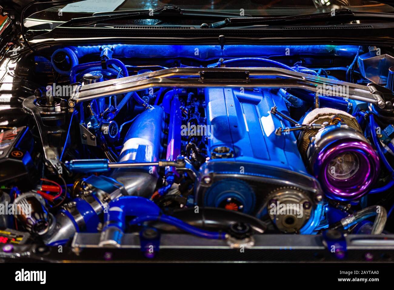 The sports car engine is illuminated with blue neon lights - image ...