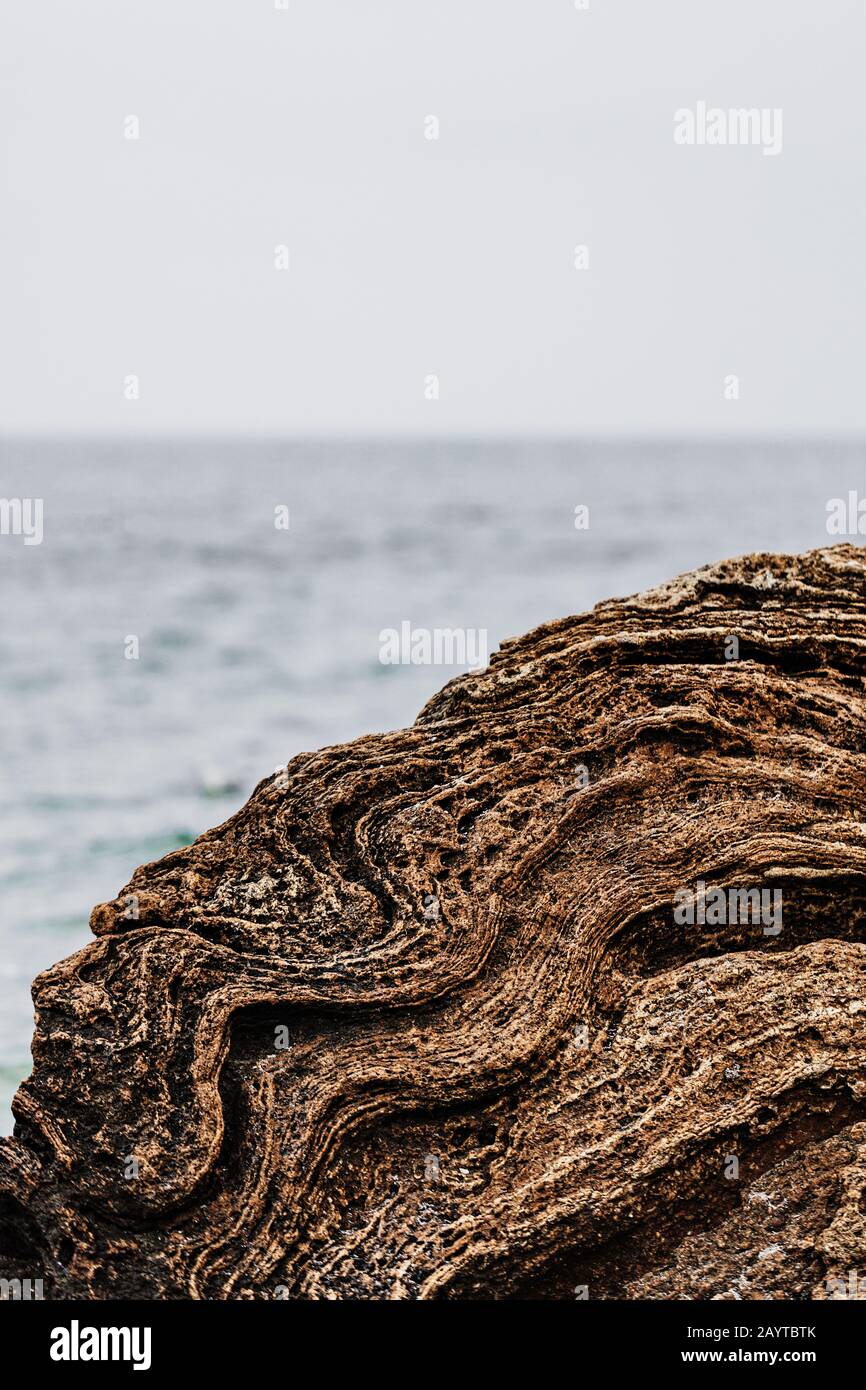 Different texture on the beach - water and sand, stones and pebbles ...