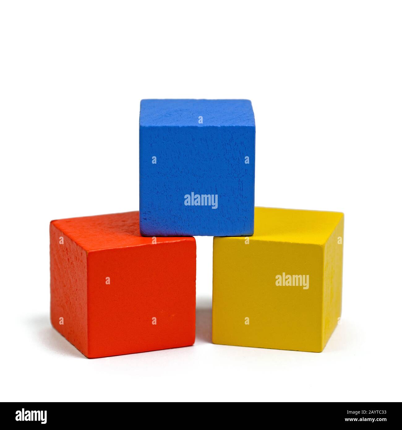 Three colorful wooden toy blocks against white background Stock Photo ...