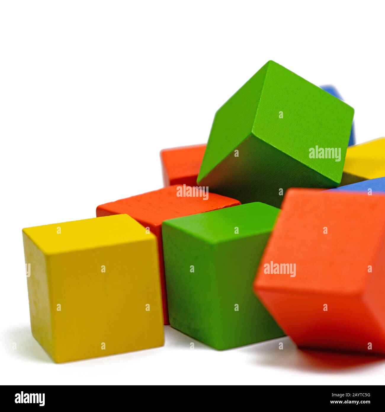 Colorful wooden toy blocks against white background Stock Photo - Alamy